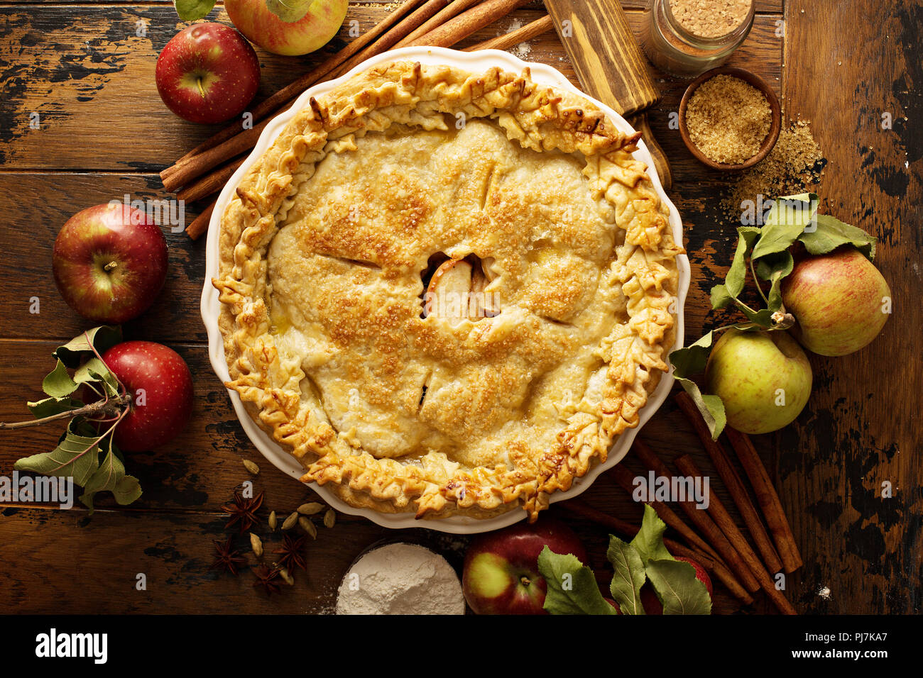 Homemade apple pie with leaves cut outs on a rustic background Stock ...