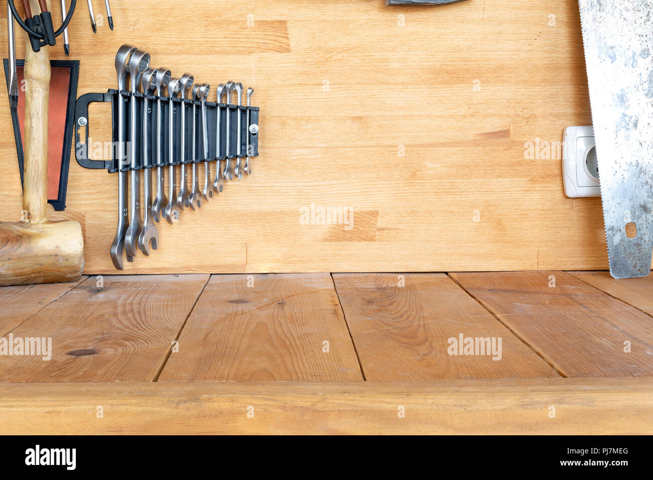 Wooden workbench at workshop. Lot of different tools for diy and repair ...