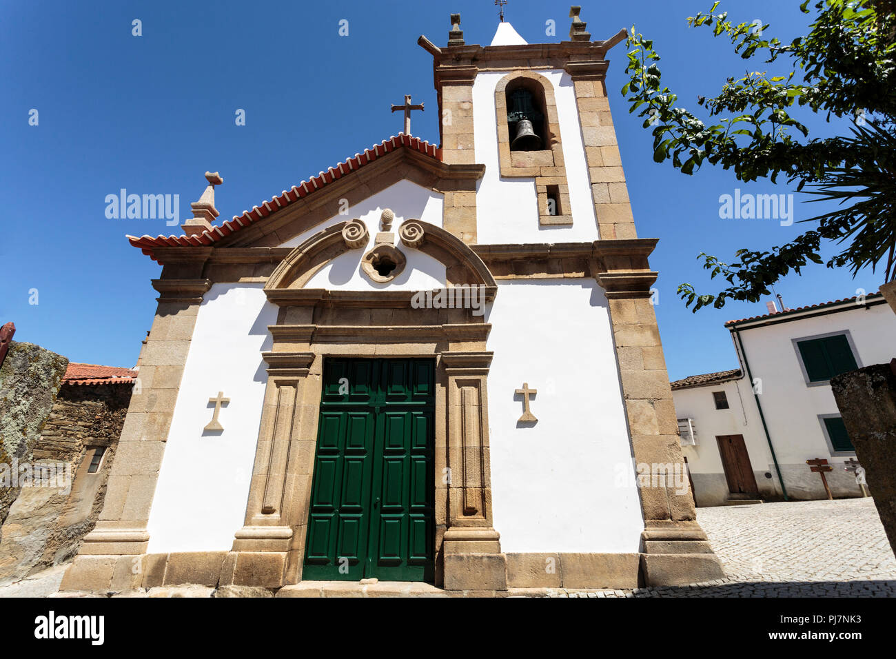 Main facade of the parish church built in the 14th century and ...