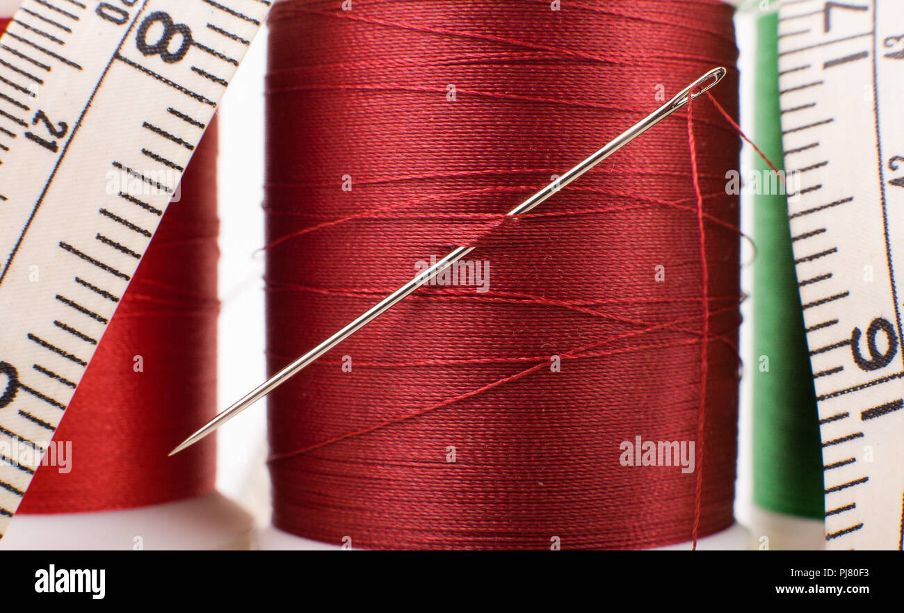 Sewing needle and string tailor craft. Tailoring tools; thread, needle ...