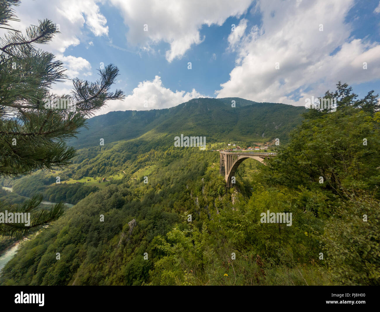 Concrete arch bridge crossing a deep valley Stock Photo - Alamy