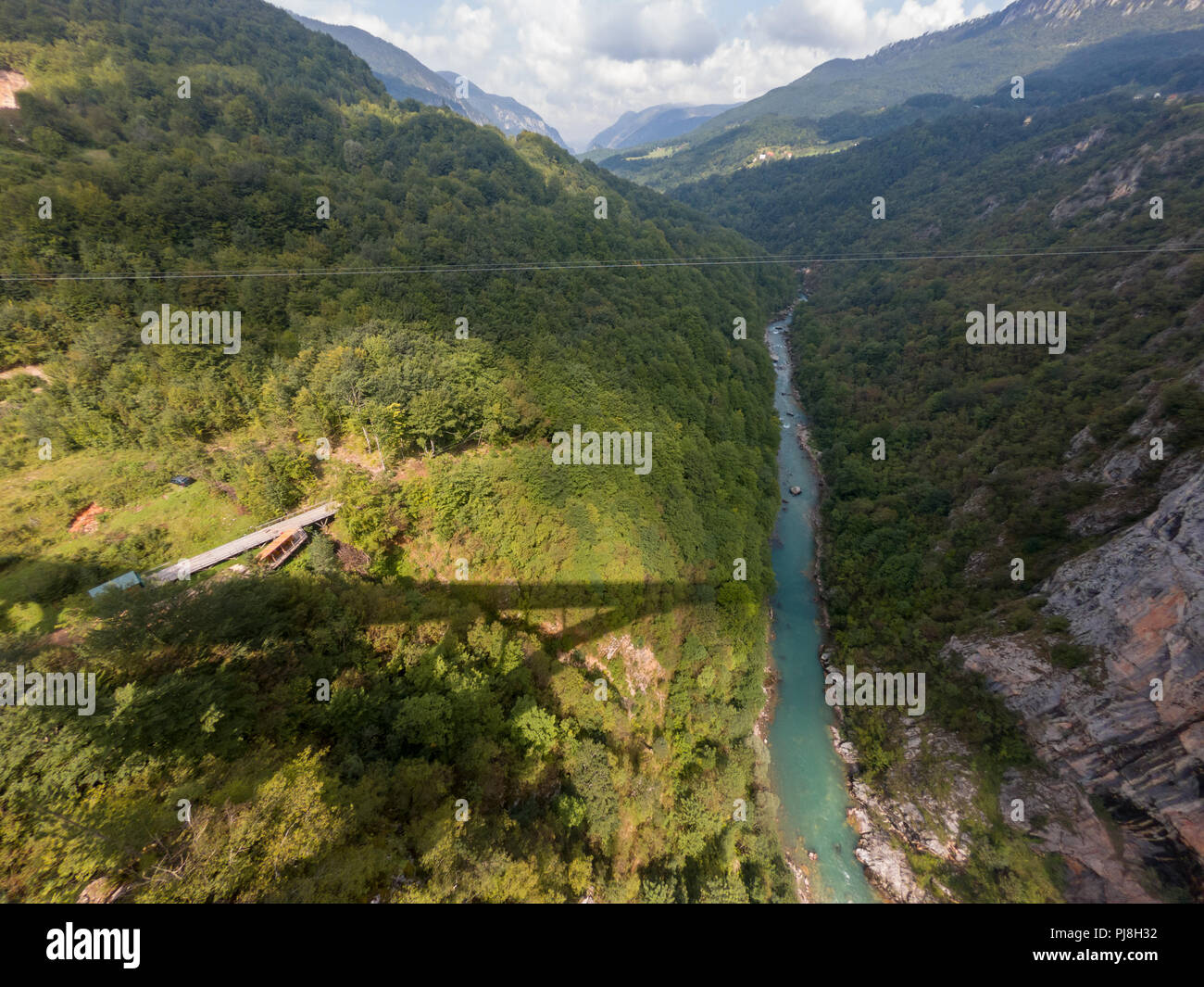 River flowing through a deep valley surrounded with forest Stock Photo ...