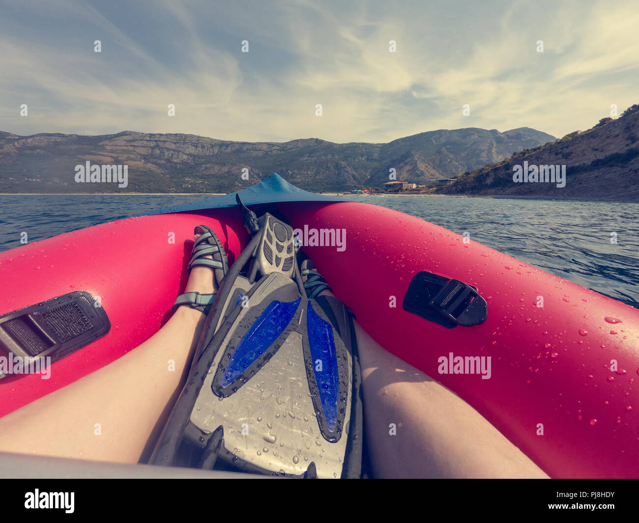 Enjoying summer while paddling in inflatable canoe at sea Stock Photo ...