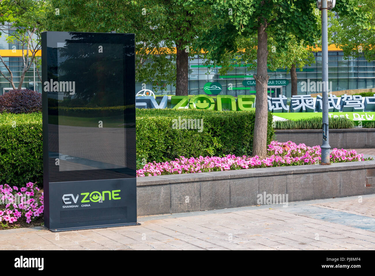 SHANGHAI, CHINA - MAY 14, 2018: Advertising signboard and logo EVZone ...