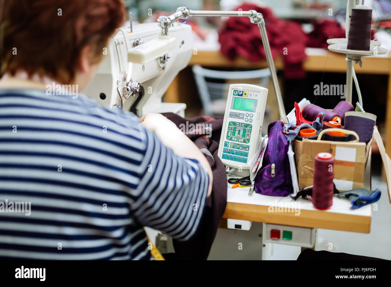 Dressmaker woman working sewing machine hi-res stock photography and ...