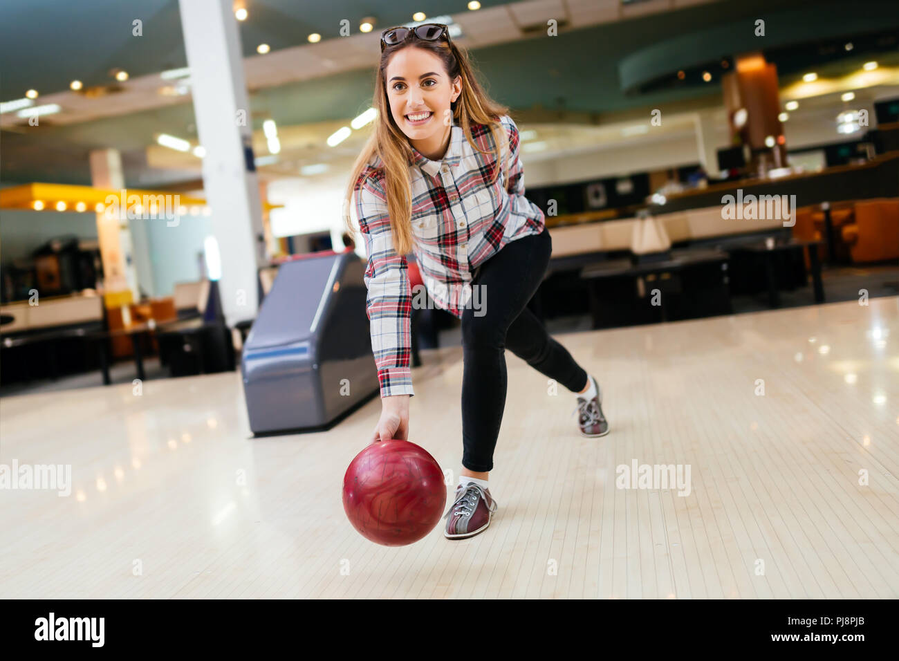 Beautiful woman bowling Stock Photo - Alamy