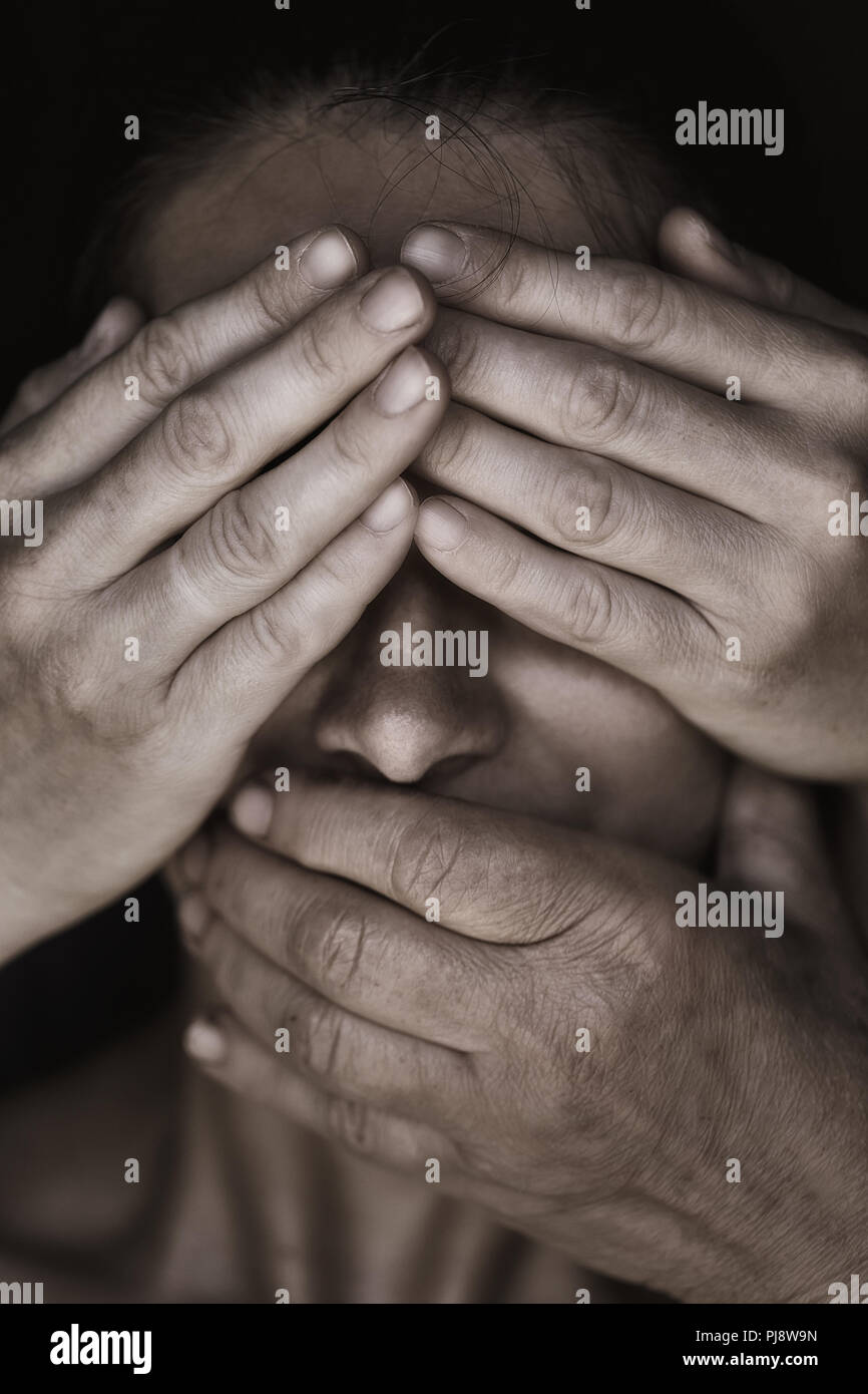 Girl face is closed by people hands, close-up Stock Photo - Alamy