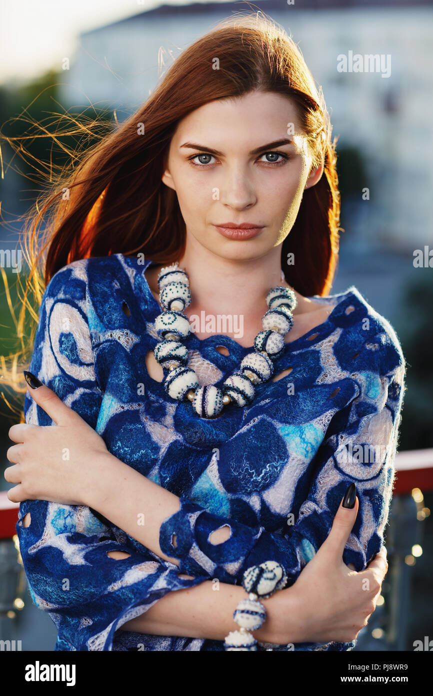 Portrait of a young beautiful girl looking directly into the camera ...