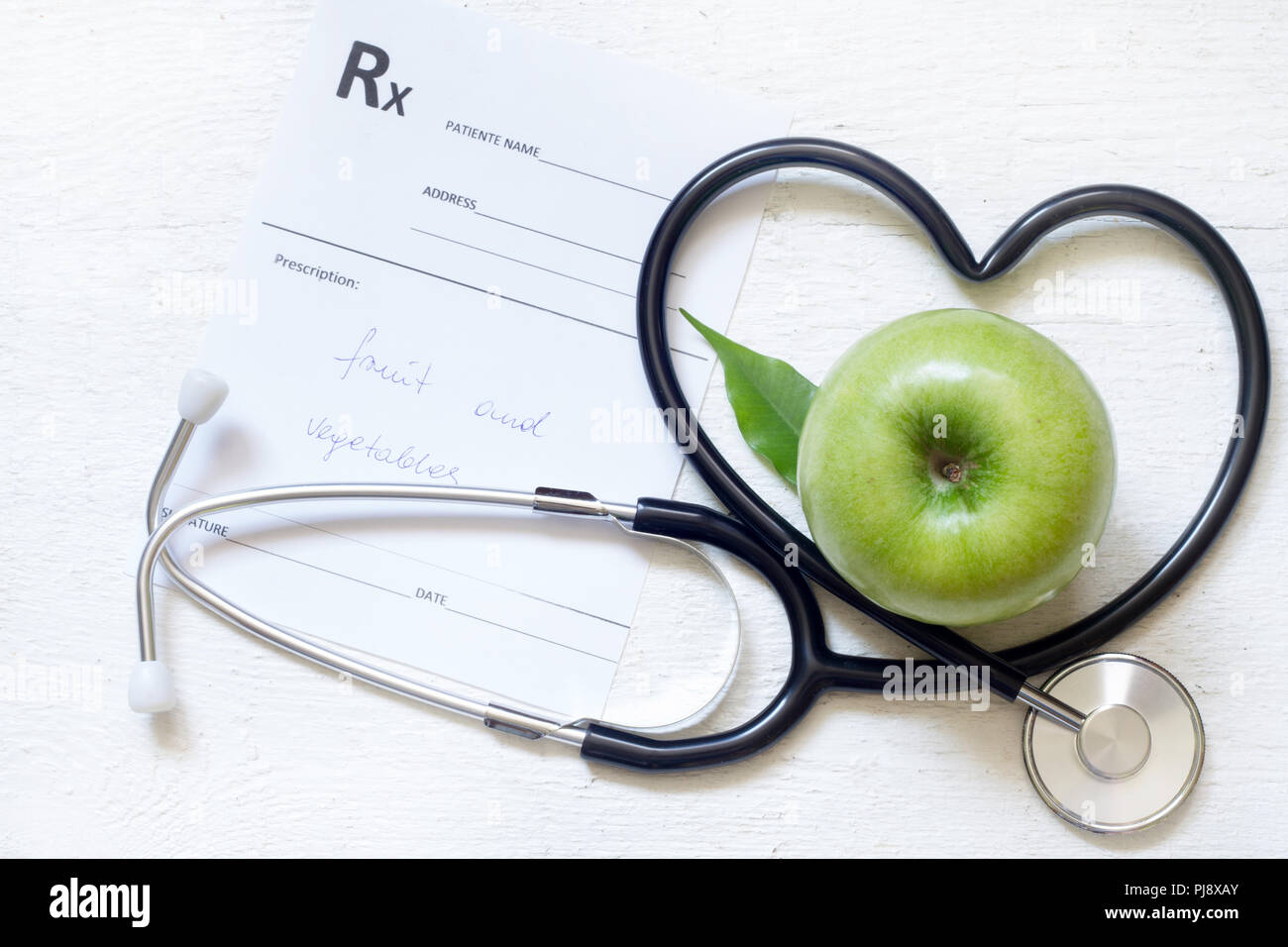 Healthy heart alternative medicine concept with stethoscope on white ...