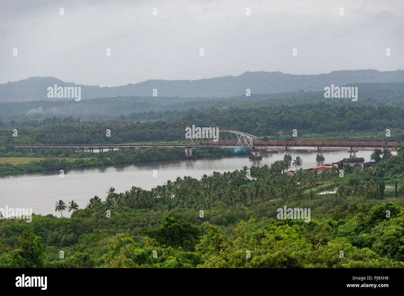 A freight train heading towards Divar Island going over the bridge on ...