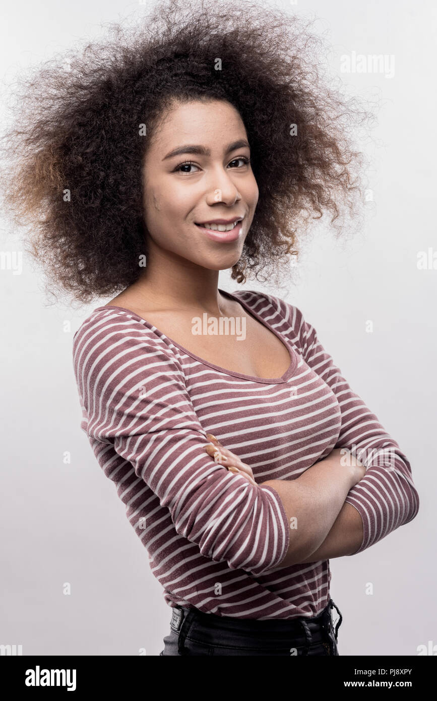 Thin pleasant beautiful woman standing in front of white wall Stock ...