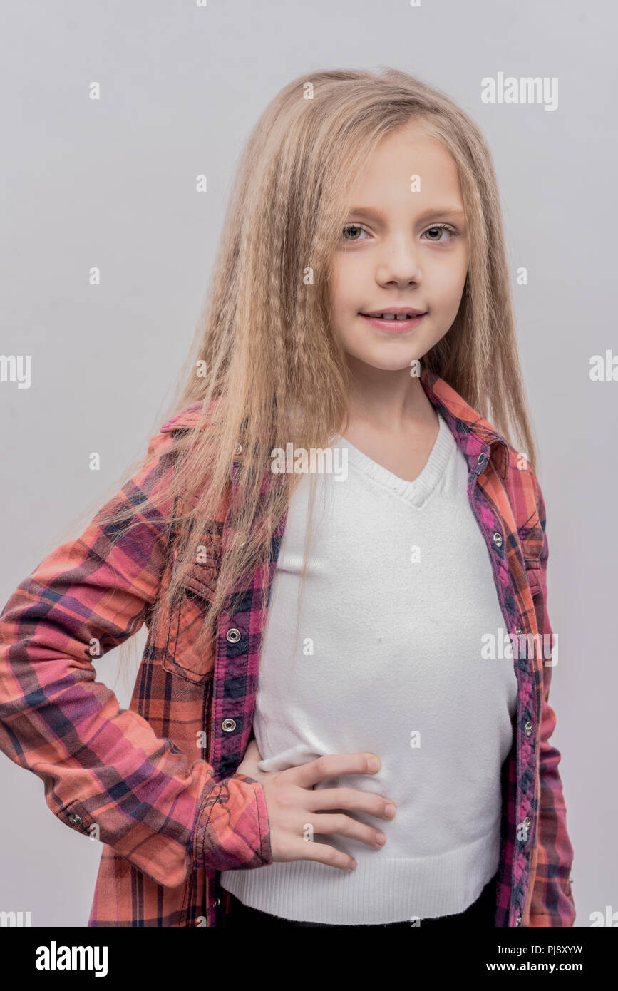 Beautiful schoolgirl with long blonde hair smiling broadly Stock Photo ... Beautiful schoolgirl with long blonde hair smiling broadly Stock Photo ...