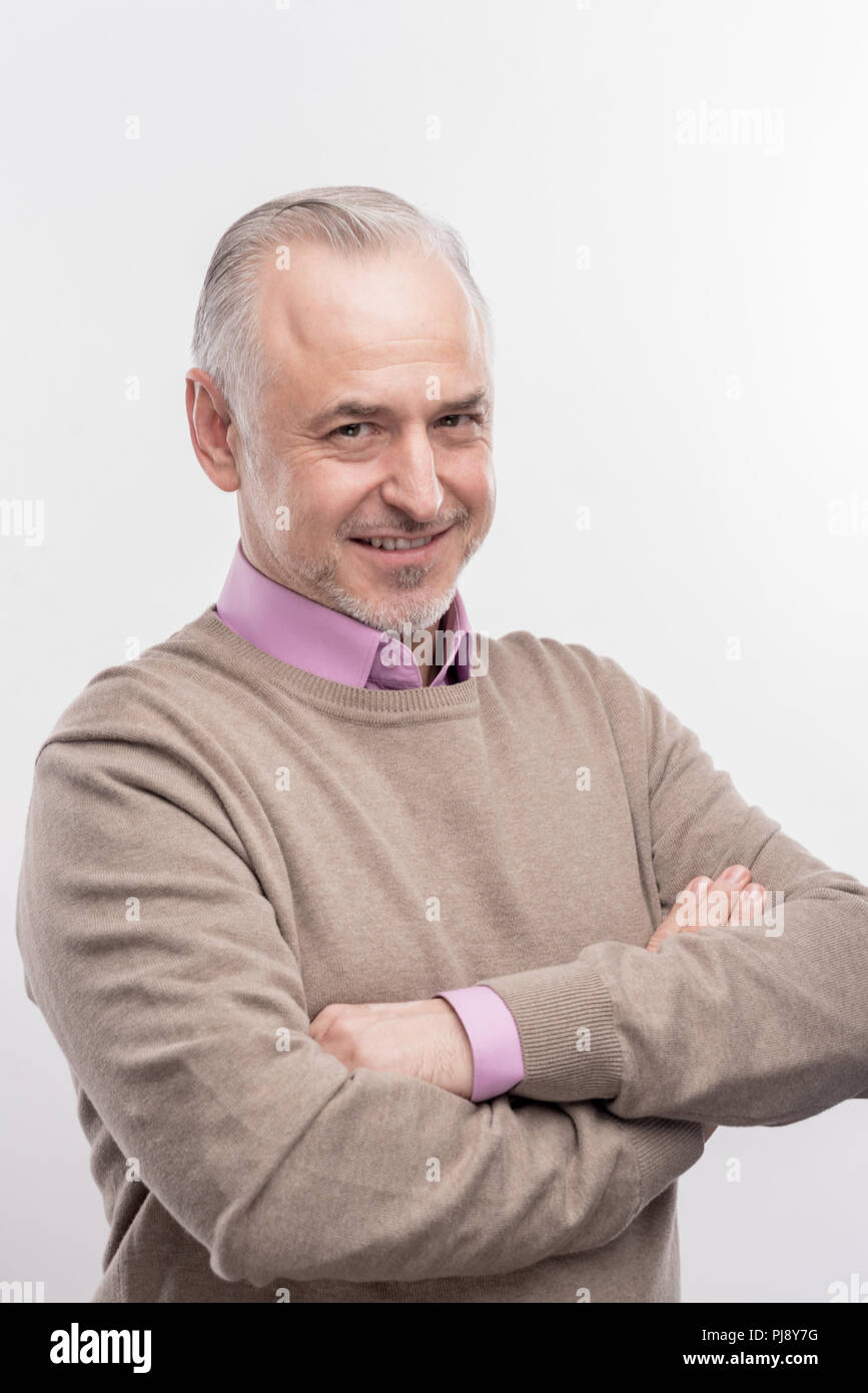Good-looking grandfather feeling happy after visiting grandchildren ...