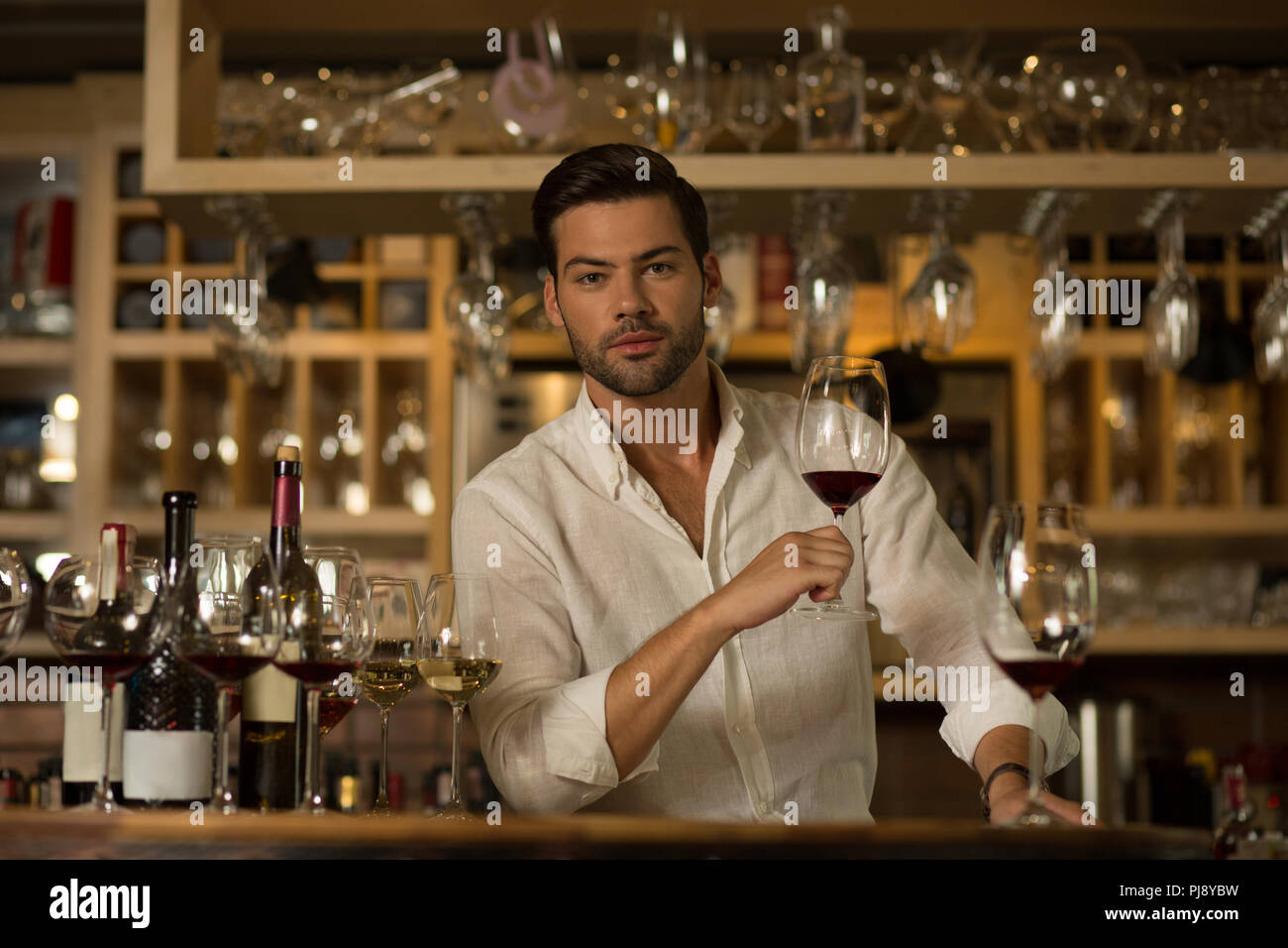 Attractive handsome young man looking at you Stock Photo - Alamy
