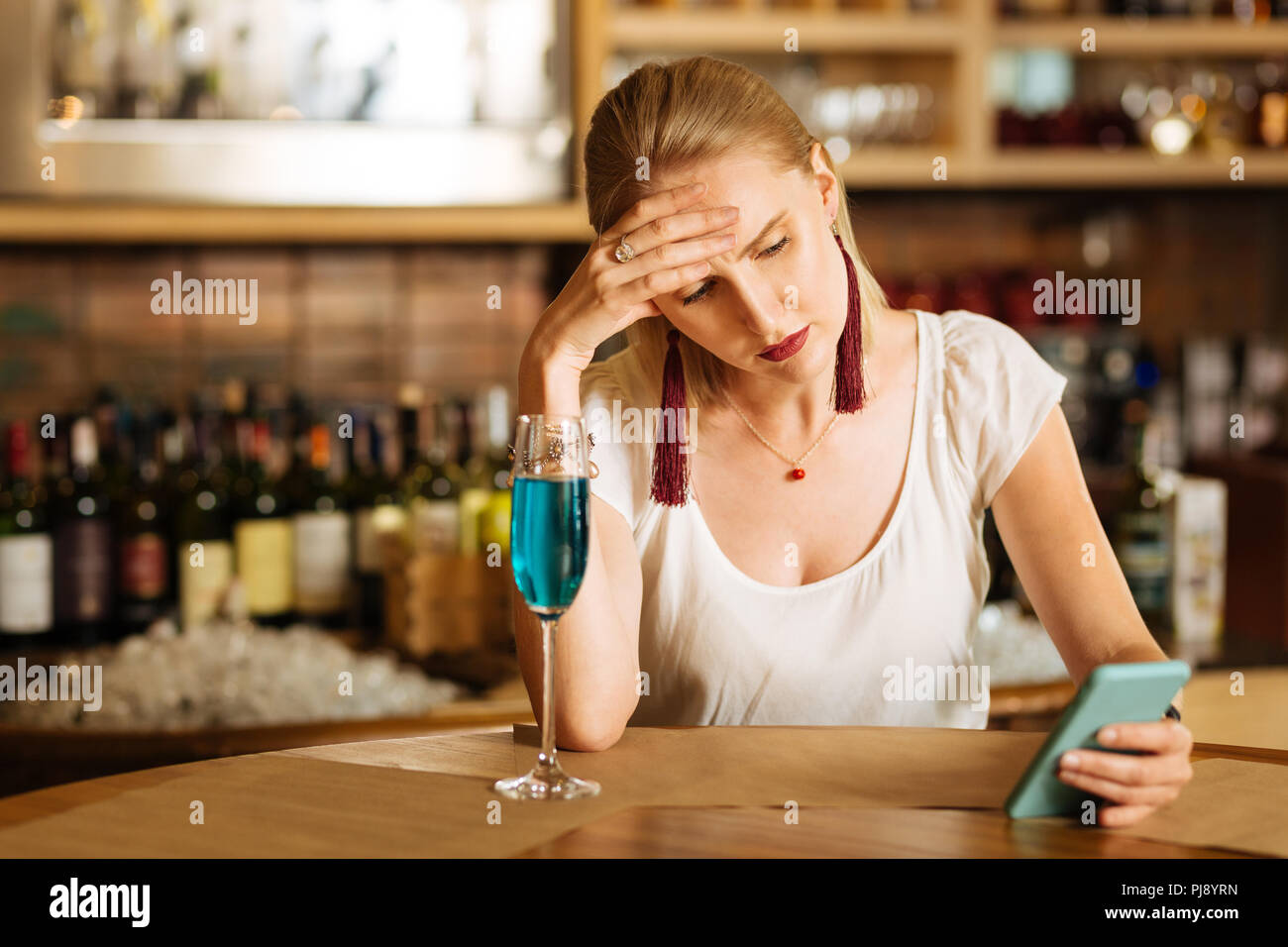 Sad depressed young woman touching her forehead Stock Photo - Alamy