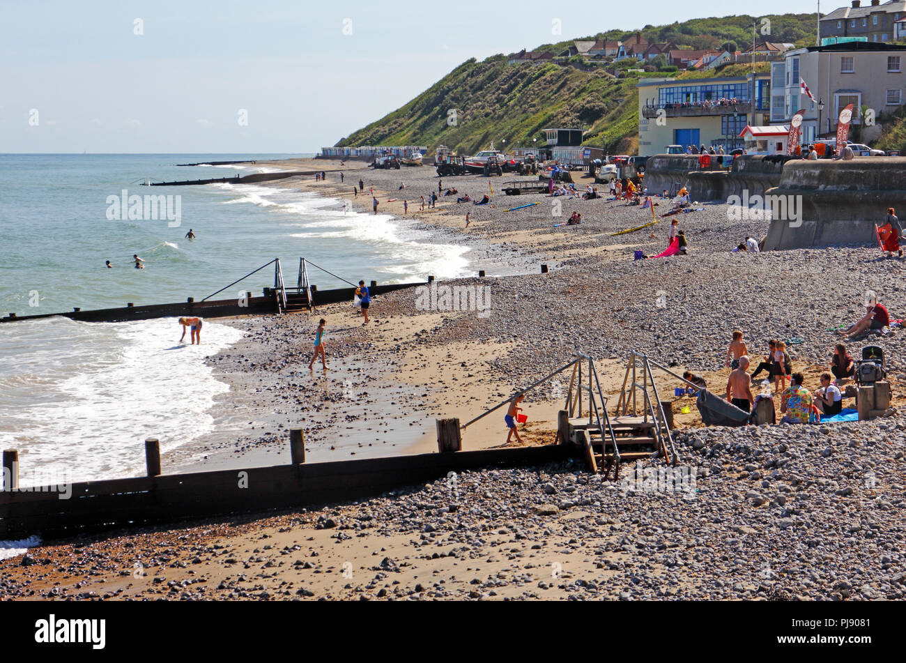 A view of the east beach with beachgoers and holidaymakers by the sea ...