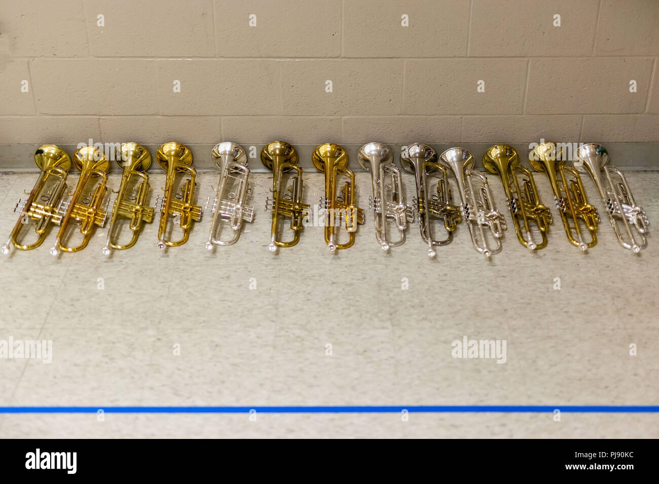 a row of resting trumpets during marching practice Stock Photo - Alamy