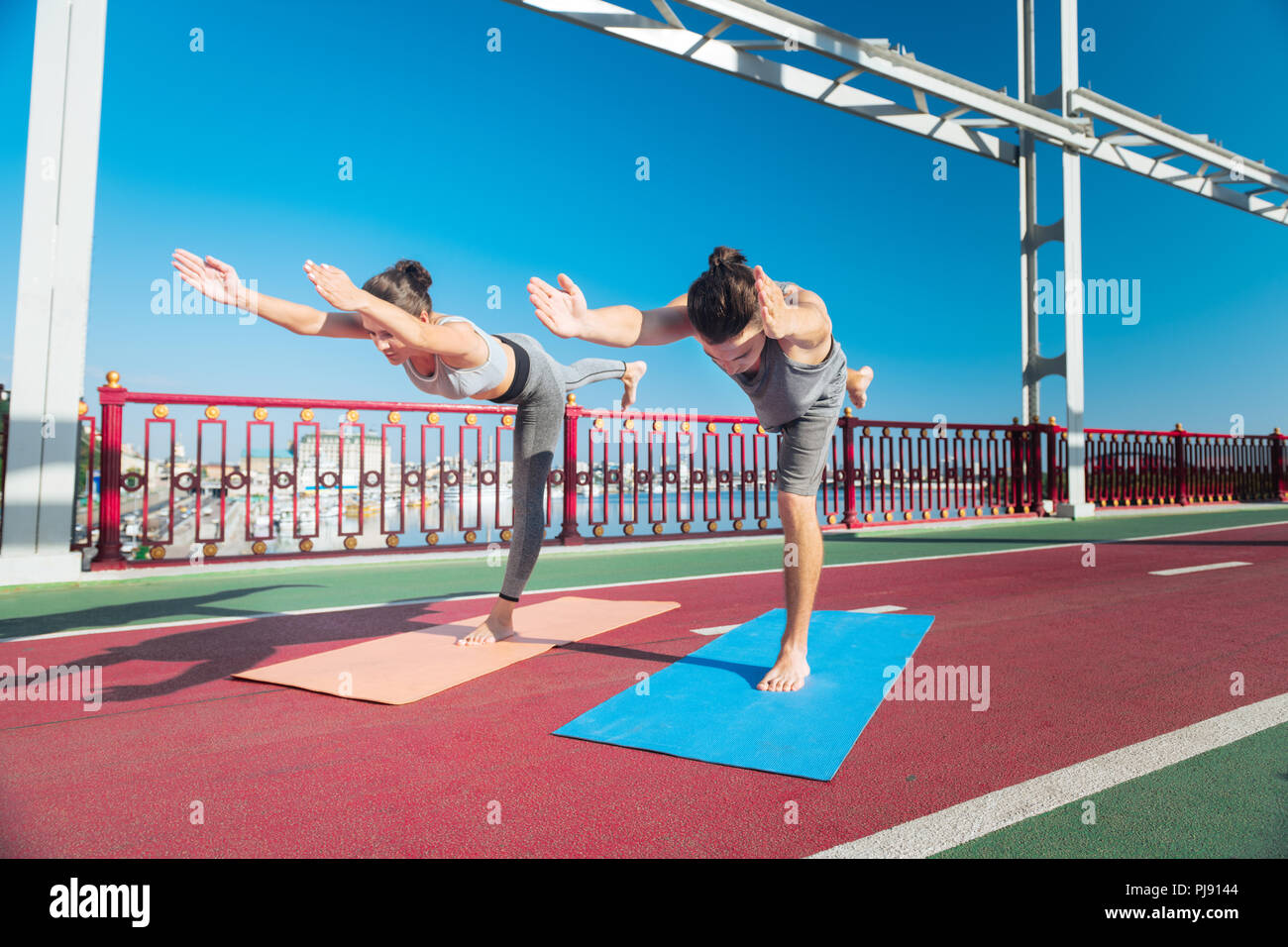 Woman improving flexibility balance hi-res stock photography and images ...