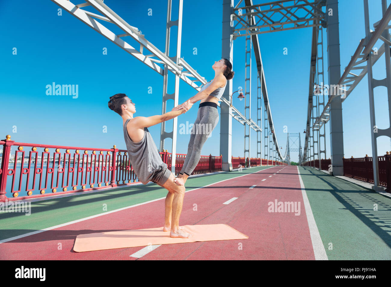 Serious woman and man having balance point Stock Photo - Alamy