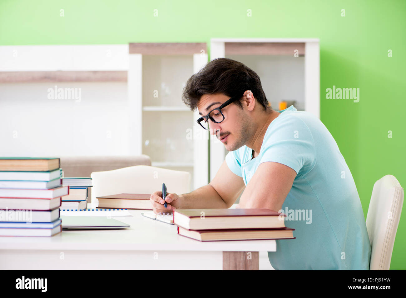Student preparing for university exams at home Stock Photo - Alamy