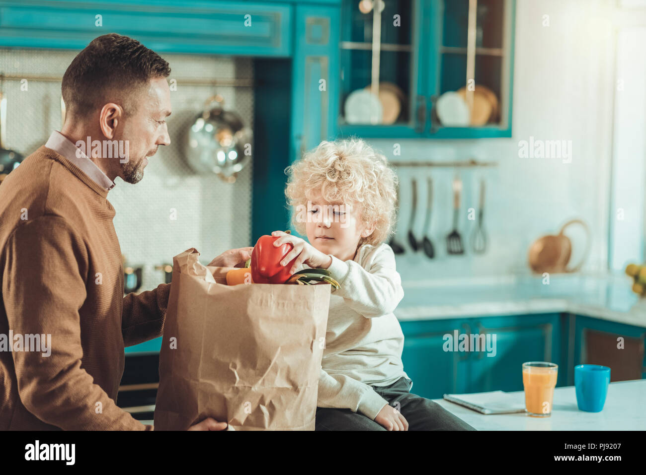 Helping cook hi-res stock photography and images - Alamy