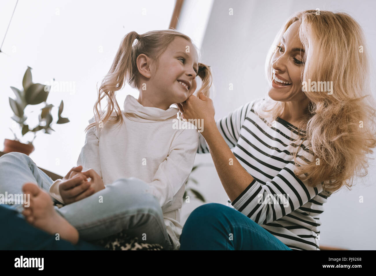 Beautiful mother looking daughter playing hi-res stock photography and ...