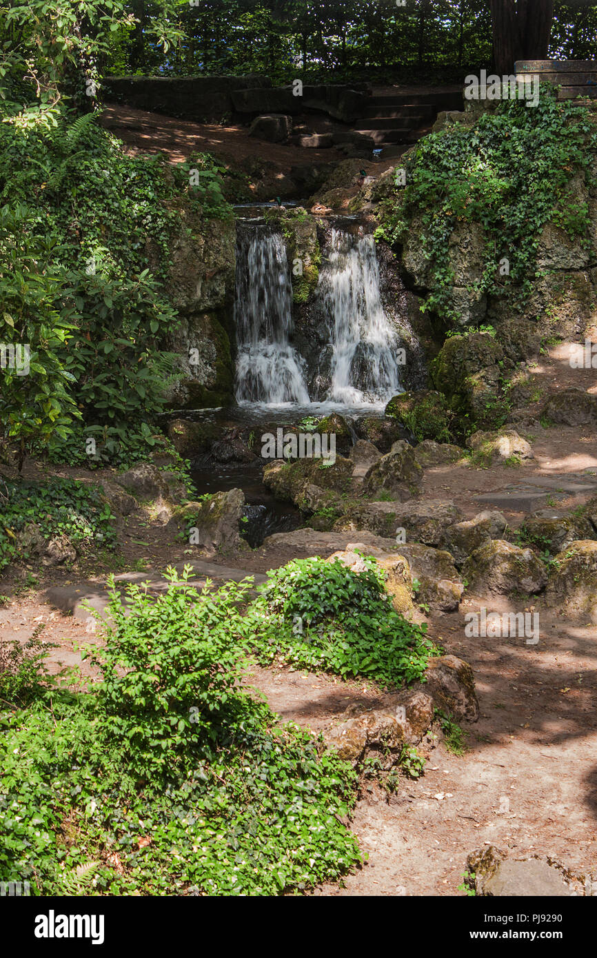 Beautiful park scene in public park with green grass field, green tree ...