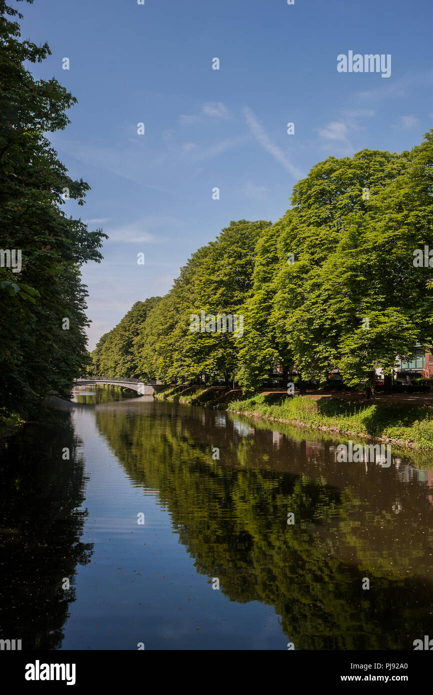 Beautiful park scene in public park with lawn trees water and ...