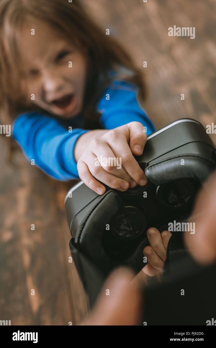 Cheerless small girl wanting to play Stock Photo - Alamy