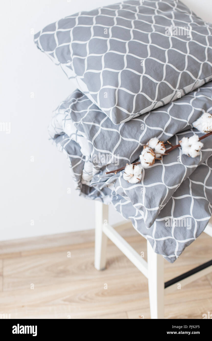 Modern grey bed linen pile, in trend, minimalism clean home concept ...