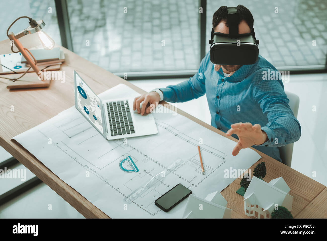 Smart intelligent man using technological developments Stock Photo - Alamy