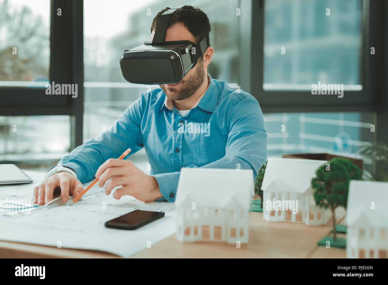 Smart professional engineer doing a blueprint Stock Photo - Alamy
