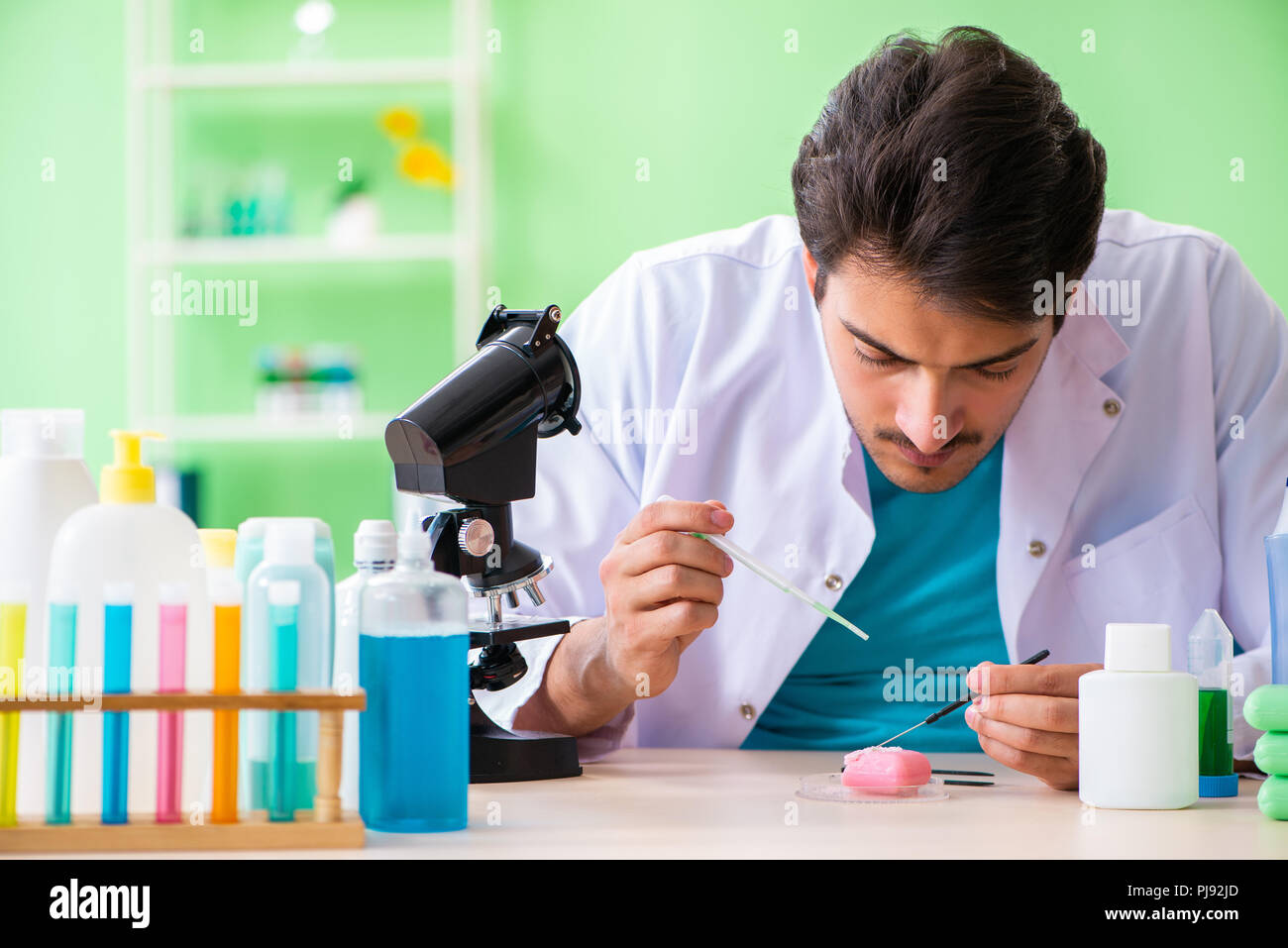 Chemist testing soap in the lab Stock Photo - Alamy