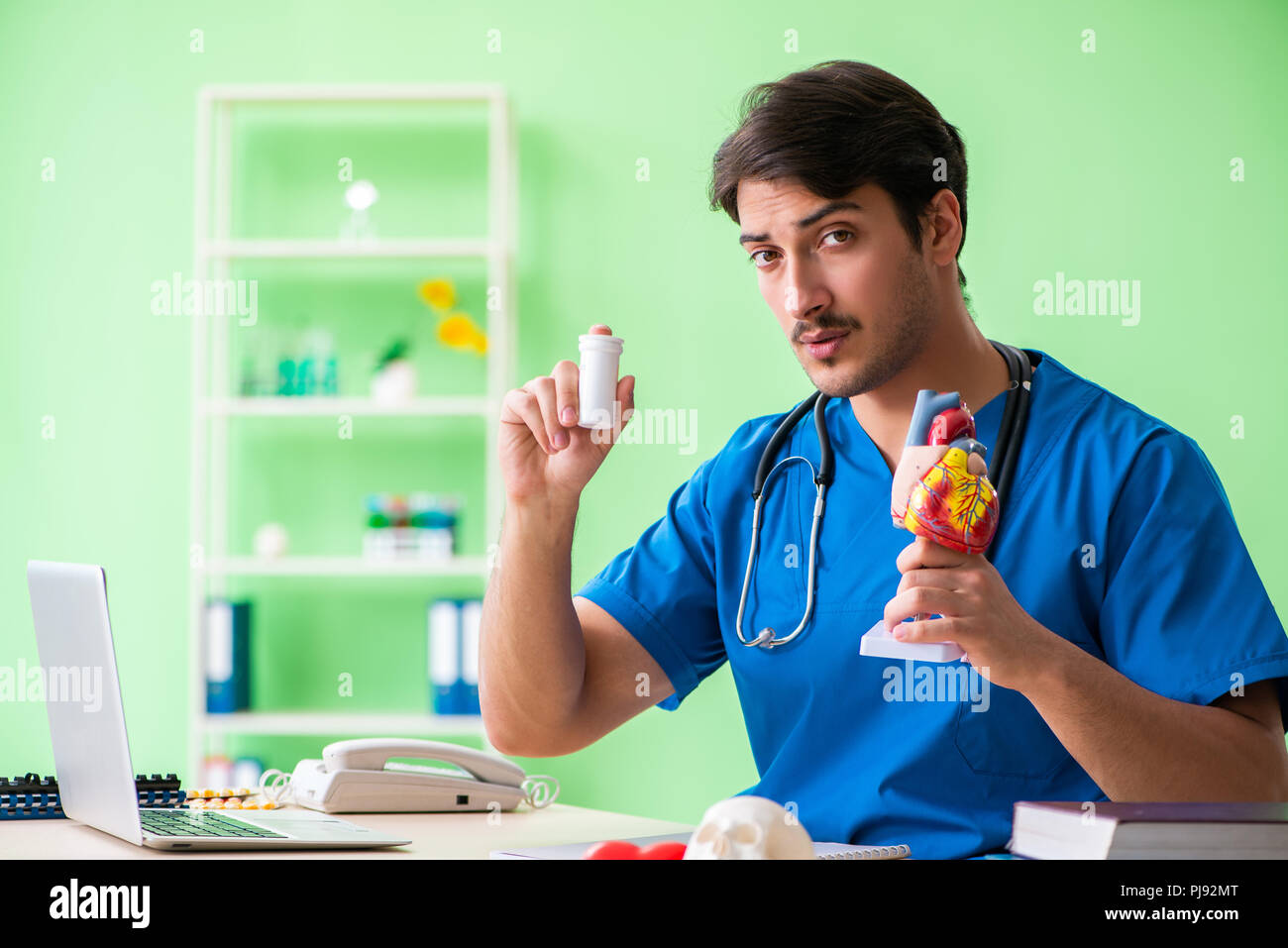 Doctor student explaining heart problems Stock Photo - Alamy