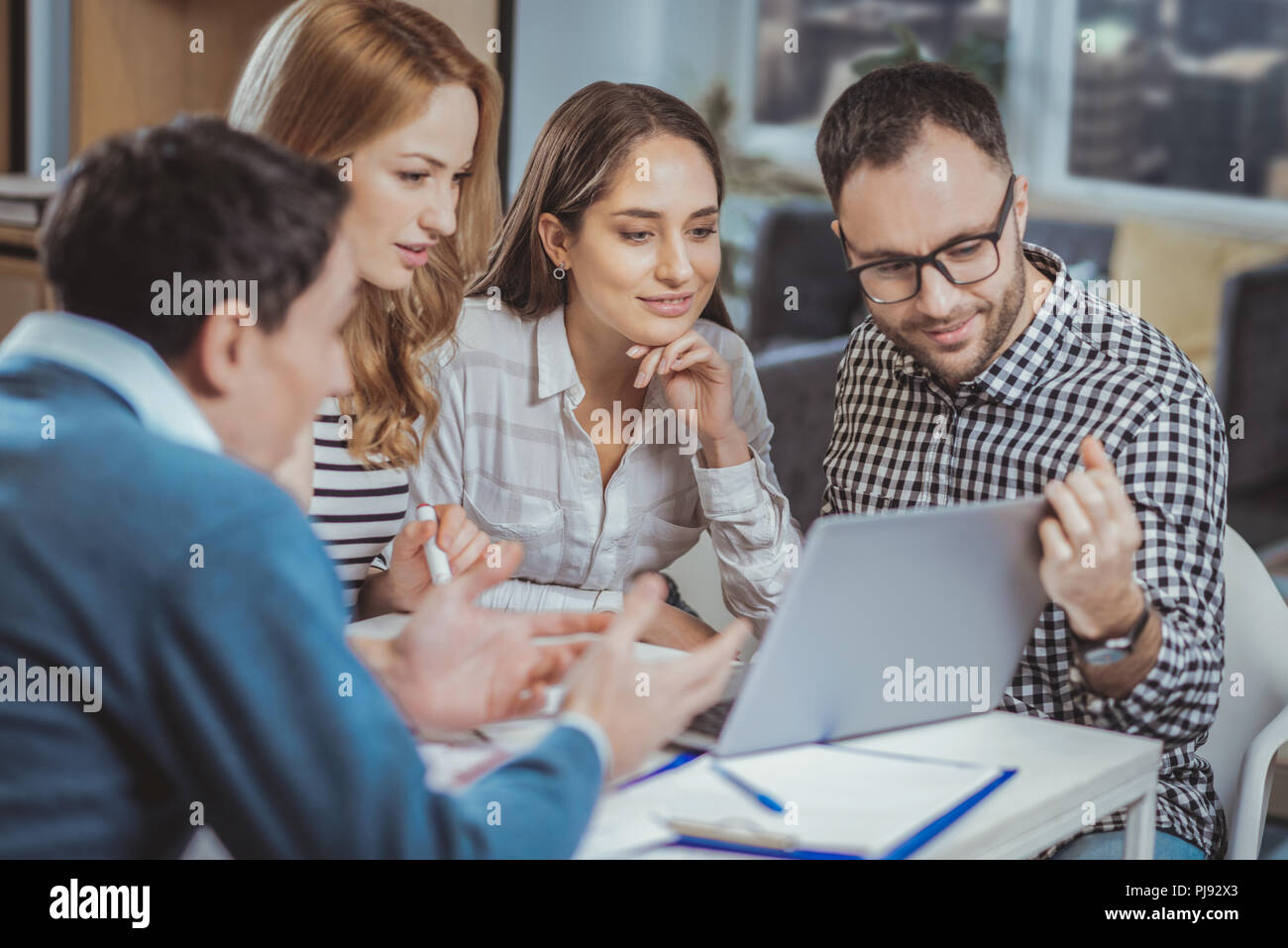 Optimistic four colleagues having online meeting Stock Photo - Alamy