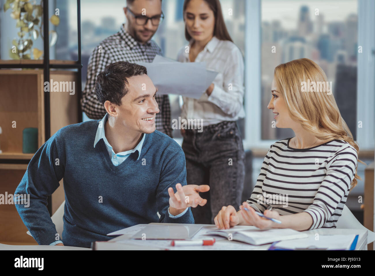 Colleagues debating hi-res stock photography and images - Alamy