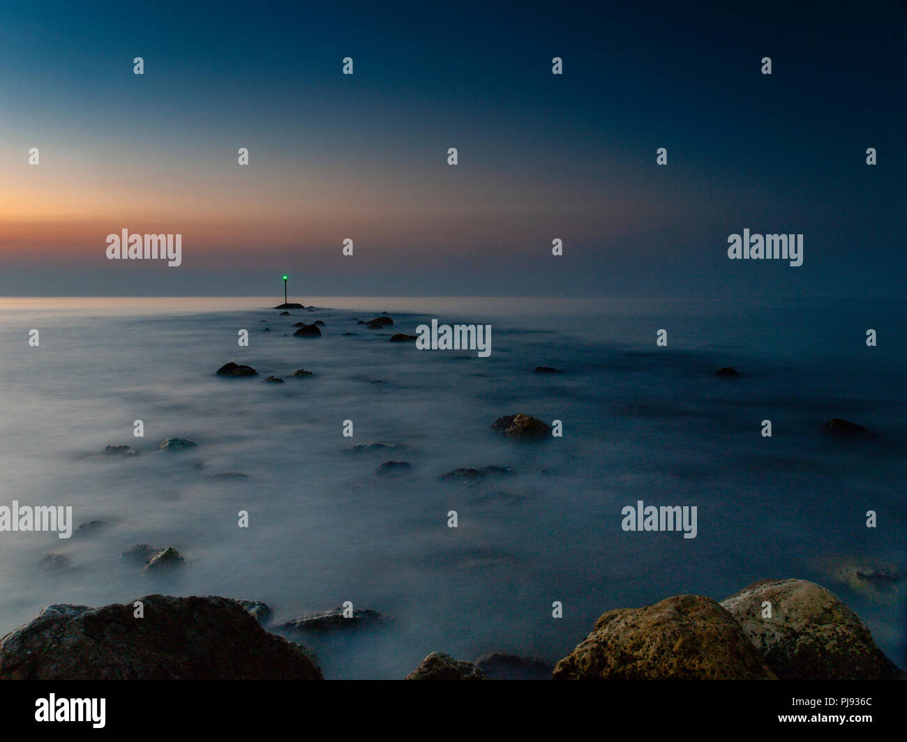 The lighthouse in the sea Stock Photo - Alamy