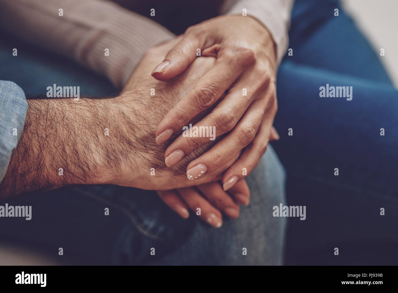 Hands young couple held hi-res stock photography and images - Alamy