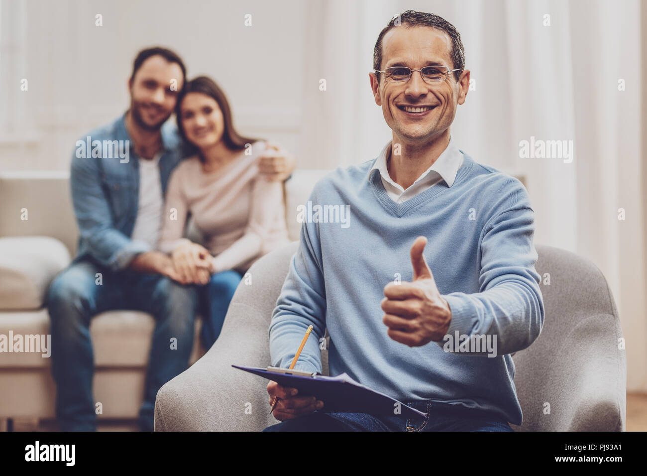 Professional male psychologist smiling Stock Photo - Alamy