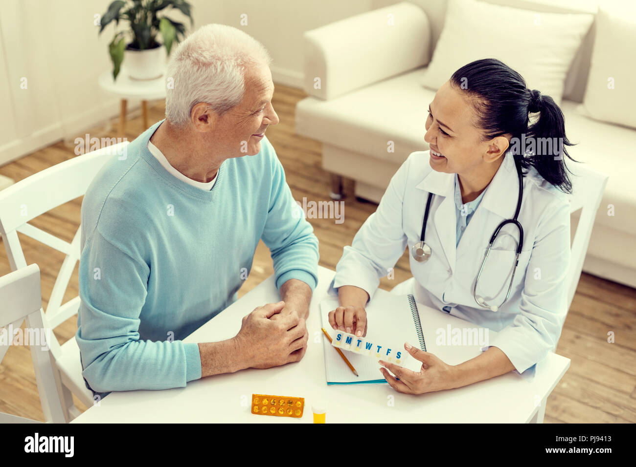 Top view of doctor and patient smiling while discussing treatment Stock ...