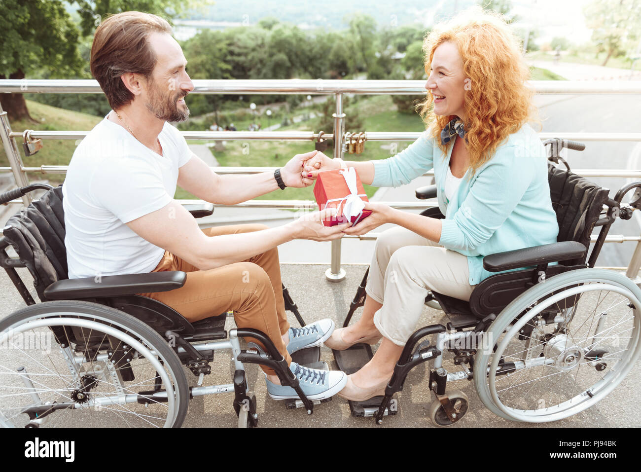 Loving disabled couple celebrating anniversary outdoors Stock Photo - Alamy