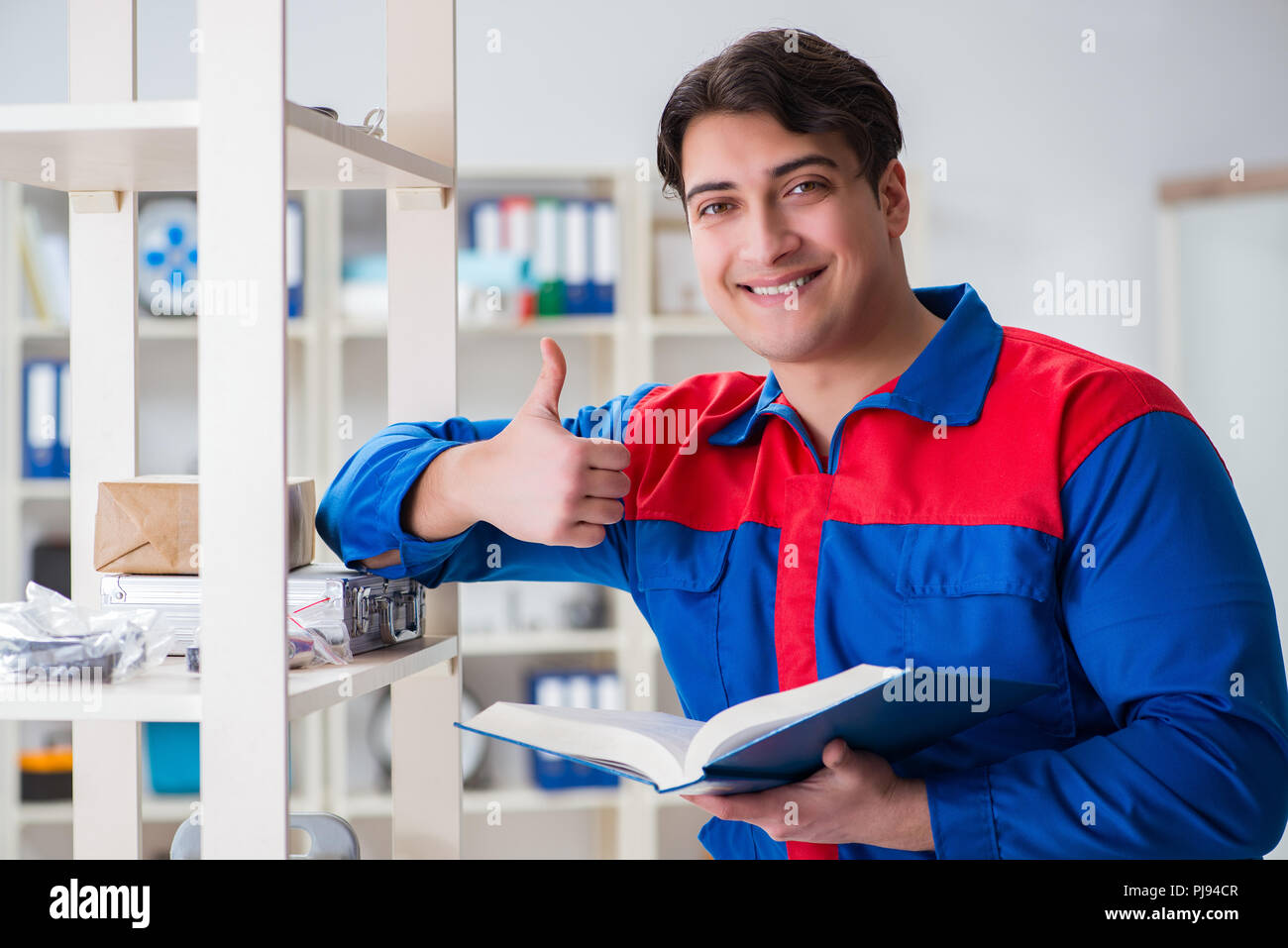 Man working in the postal warehouse Stock Photo - Alamy