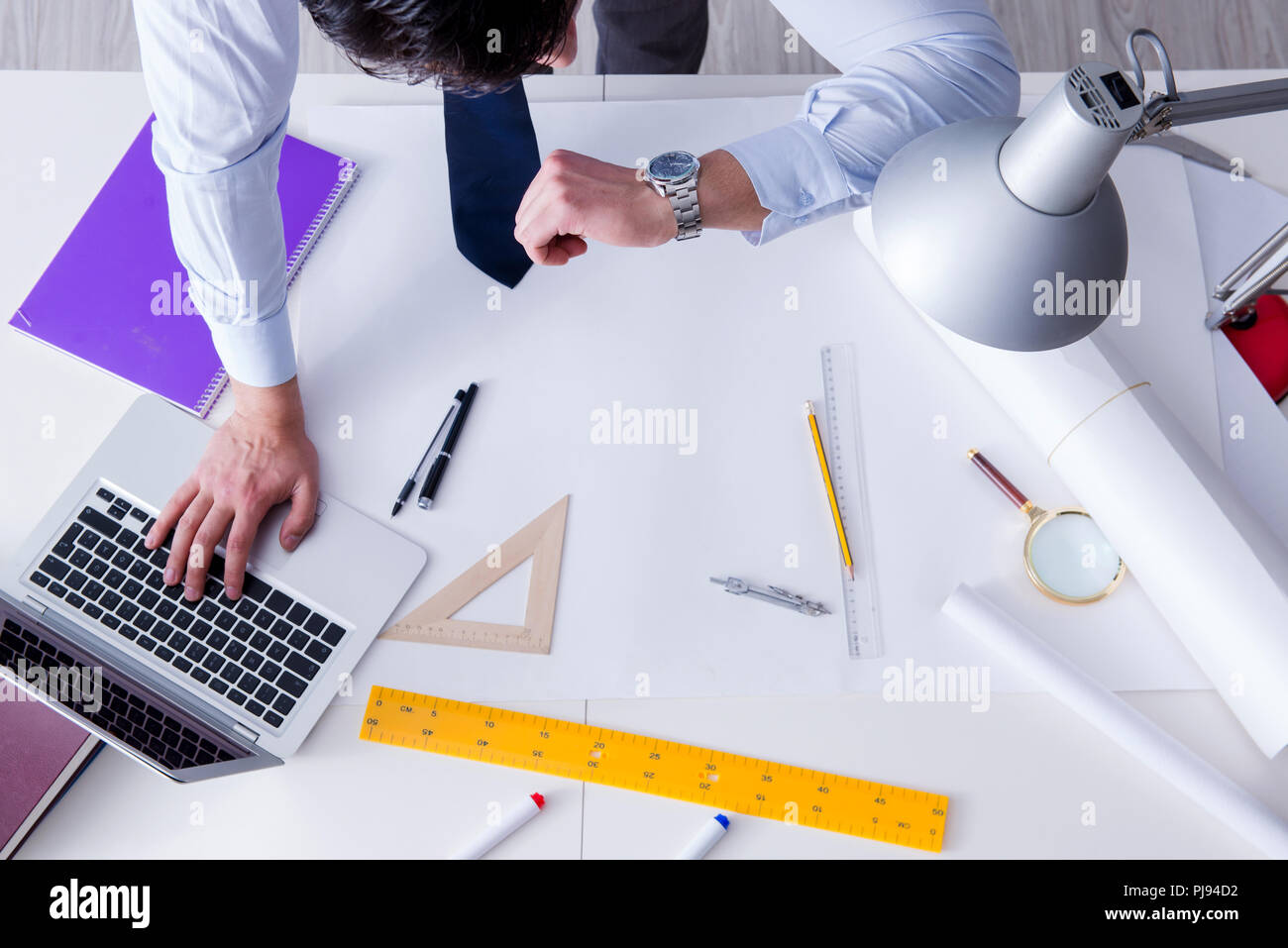 Engineer working on new project drawings Stock Photo - Alamy