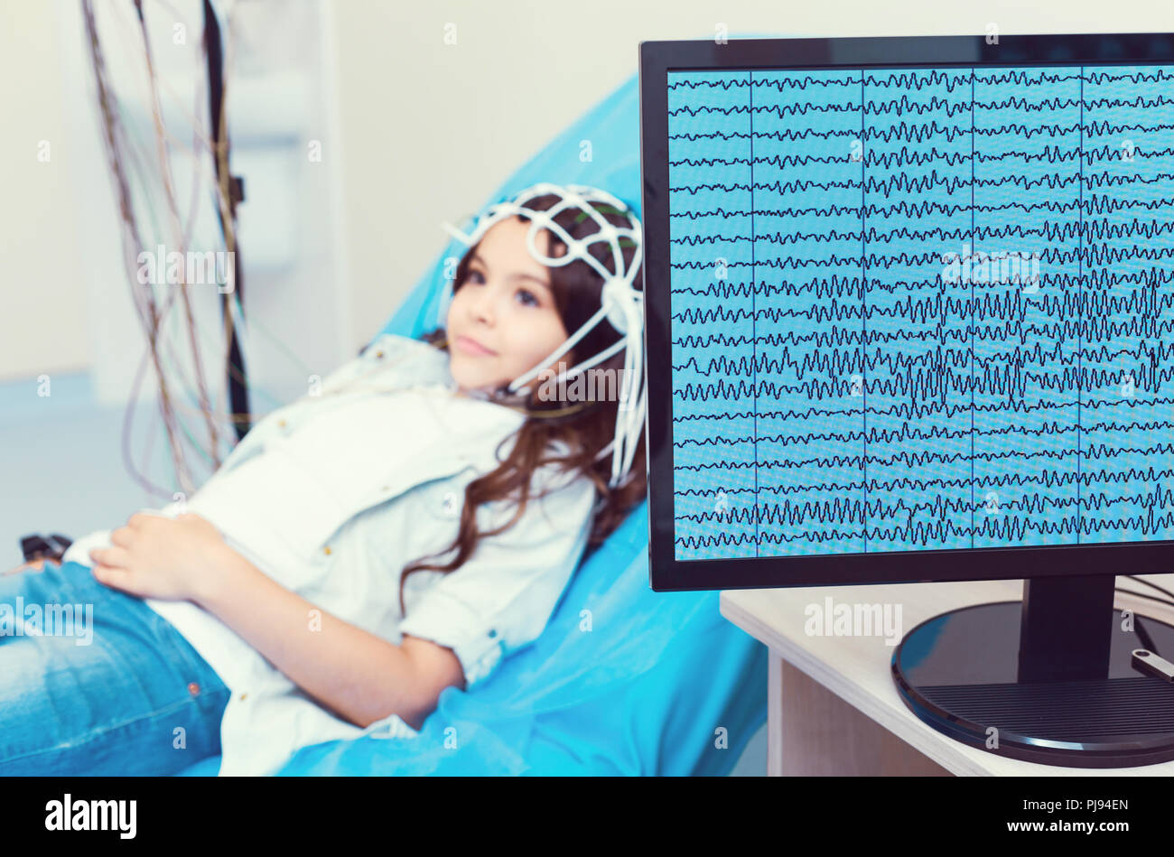 Computer recording brain waves of little girl undergoing ...