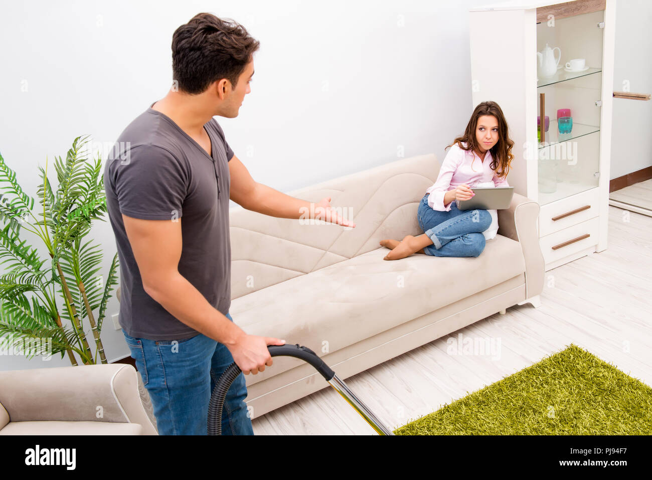 Cleaning the house with vacuum cleaner Stock Photo - Alamy