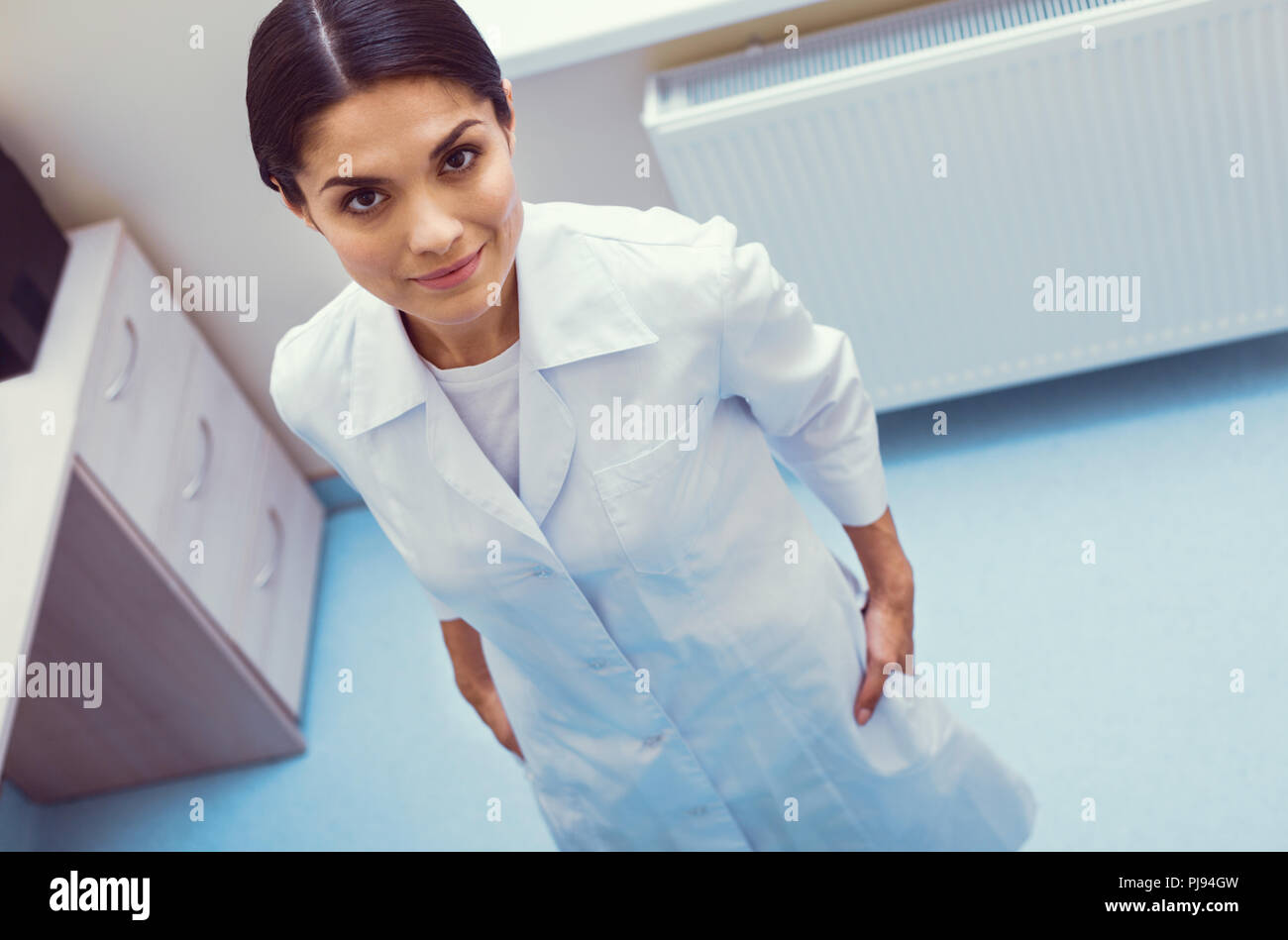 Female laboratory worker smiling into camera Stock Photo - Alamy