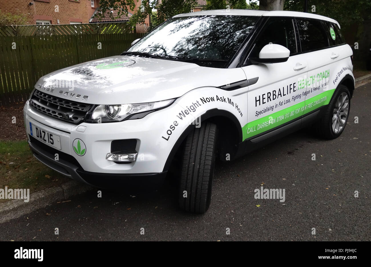 Car Front view of a Herbalife Health Coach Range Rover Evoque Sign ...