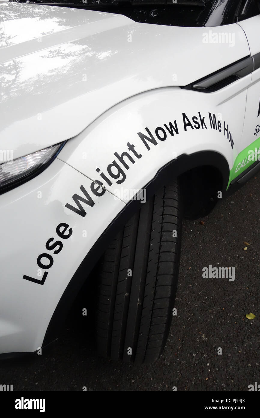 ' Lose weight now, ask me how' written on a wheel arch on a Herbalife ...