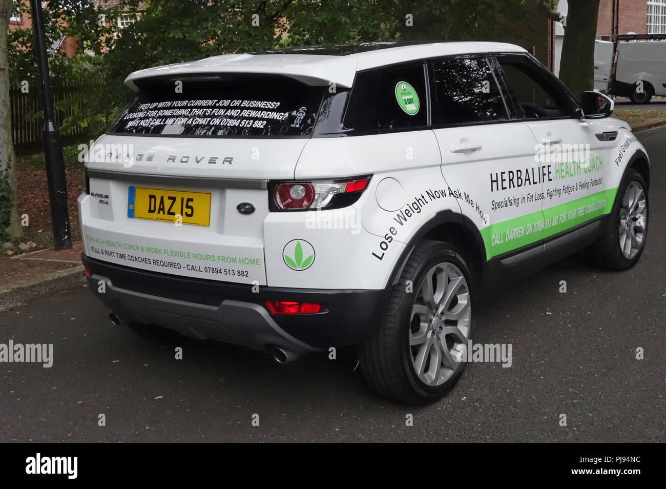 Rear view of a Herbalife Health Coach Range Rover Evoque Sign written ...