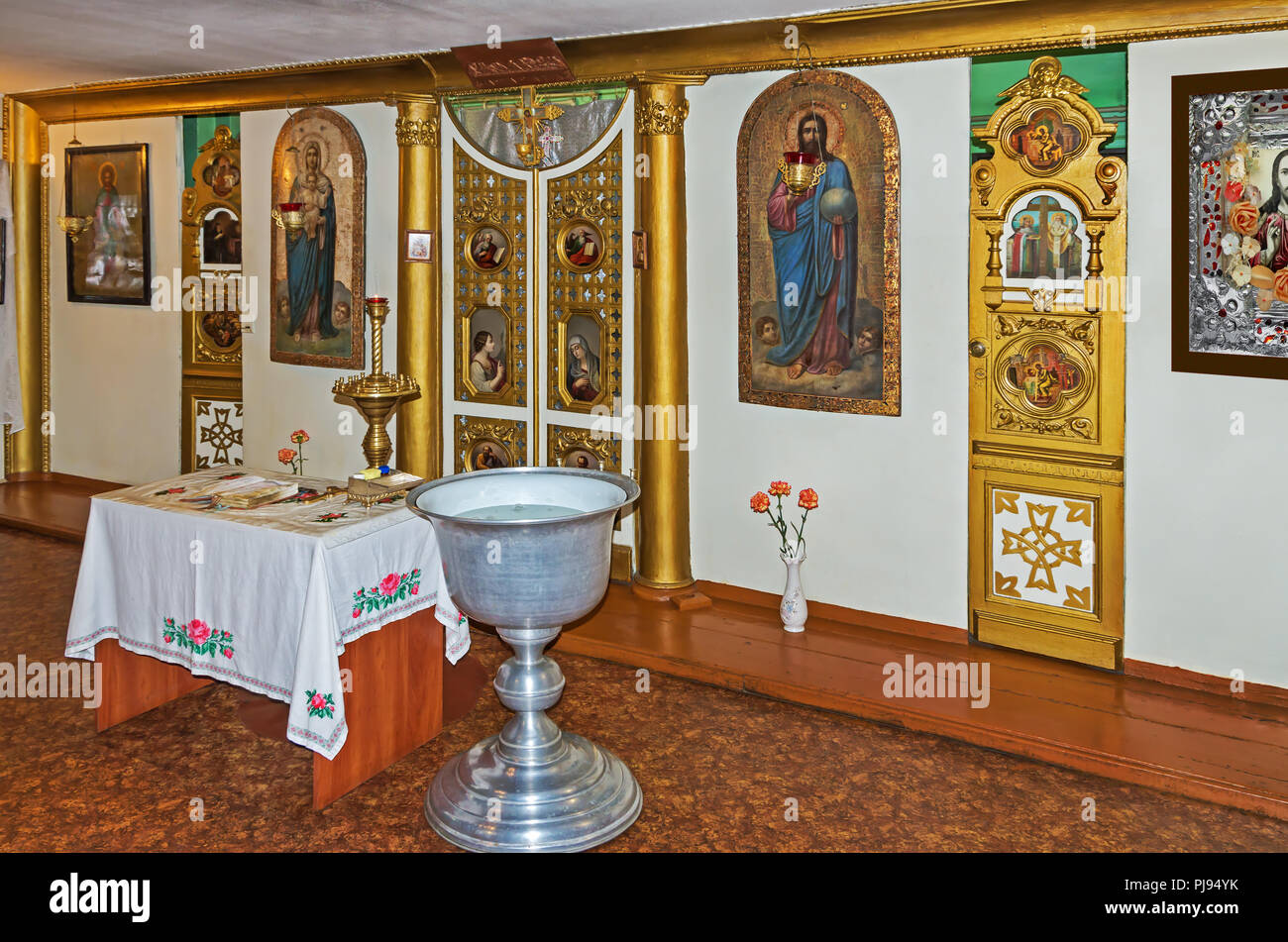 A baptismal font, a throne and altar in the room for the performance ...